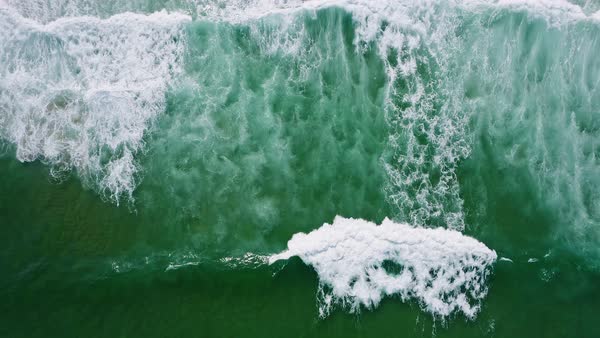 Waves and emerald green ocean water surface near sandy beach - 4K ...