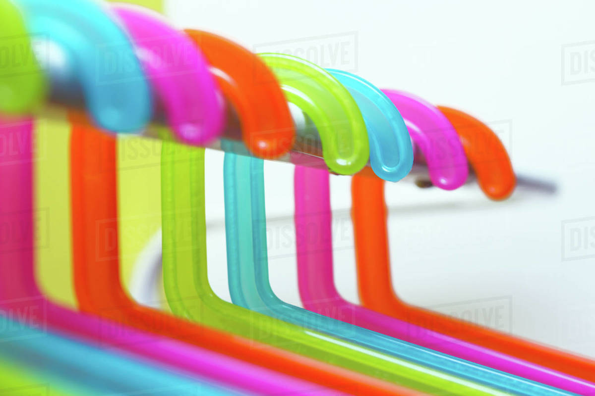 Multicolored hangers on white background with small depth of field ...