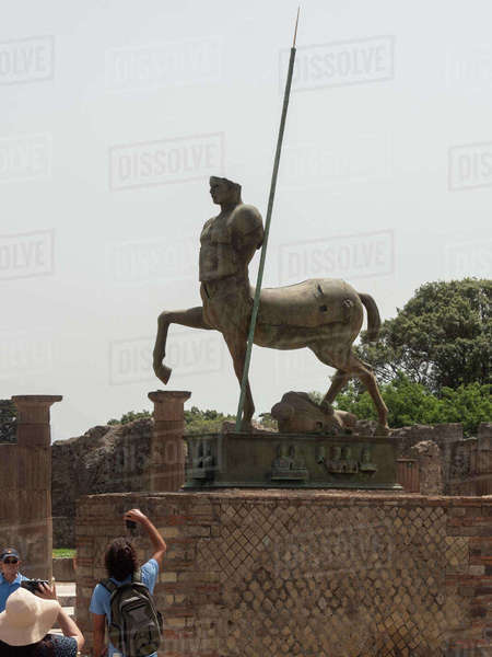 NAPLES, ITALY: a modern art bronze statue of a centaur at the ruins of ...