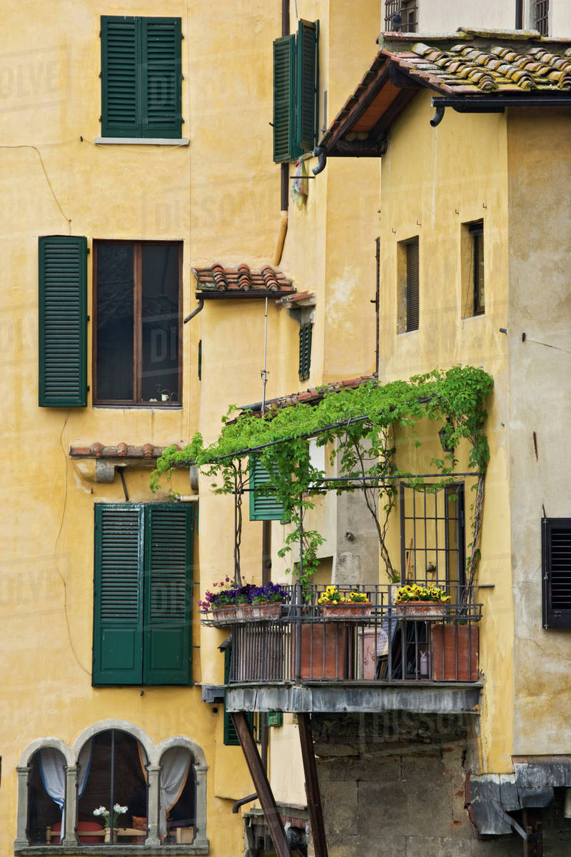 Italy, Tuscany, Florence. Balcony and buildings near the Ponte Vecchio ...