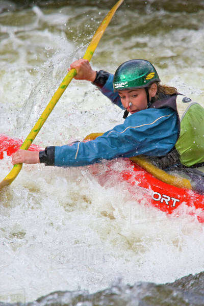 USA, Colorado, Frisco. Woman competitor in Kayak Rodeo on Ten-Mile ...