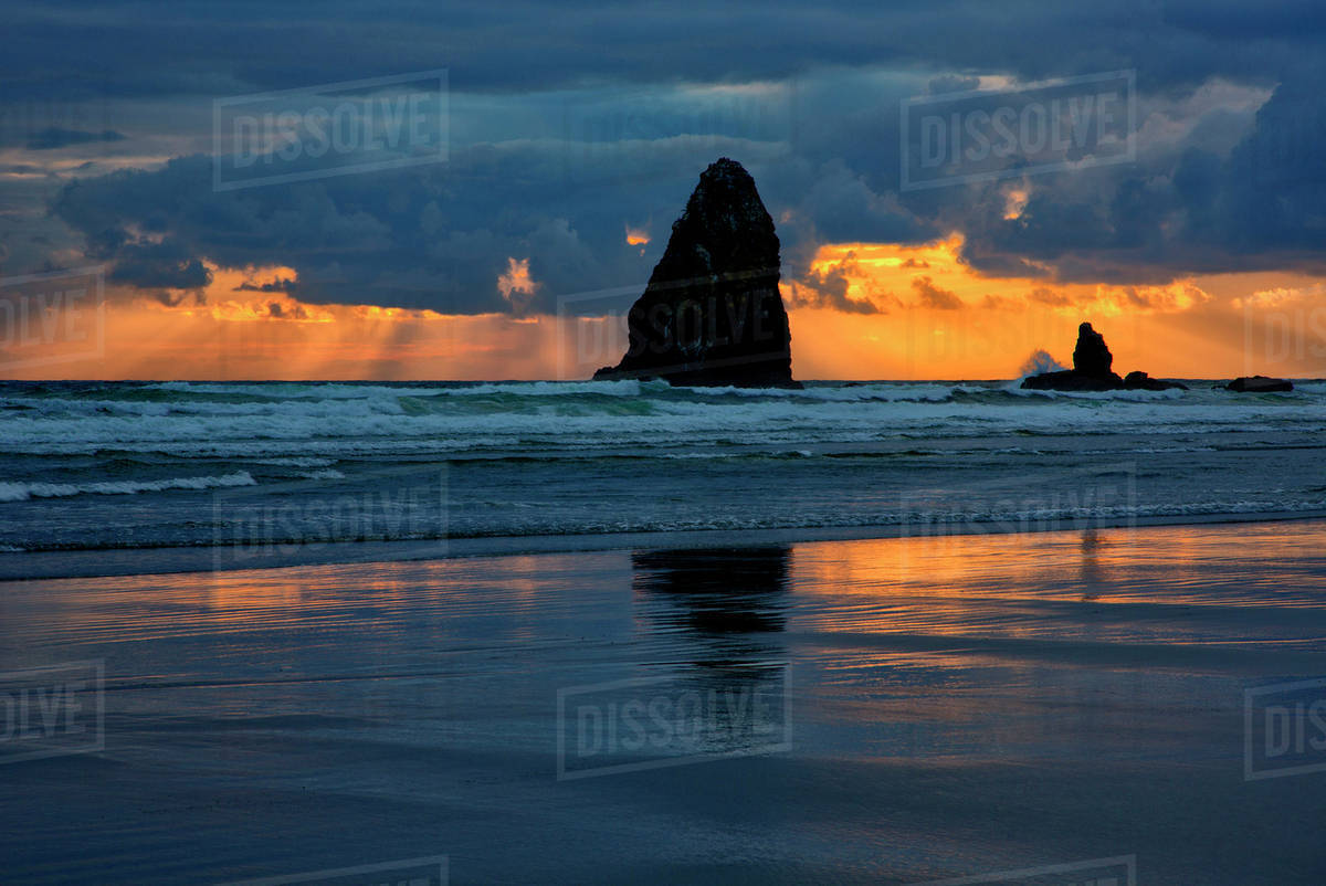 USA, Oregon, Cannon Beach. Sunset on The Needles sea stack. - Stock ...