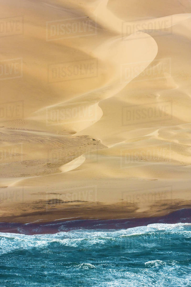 Namibia, Africa. Aerial view of Namibian Sand Dunes meeting the ...