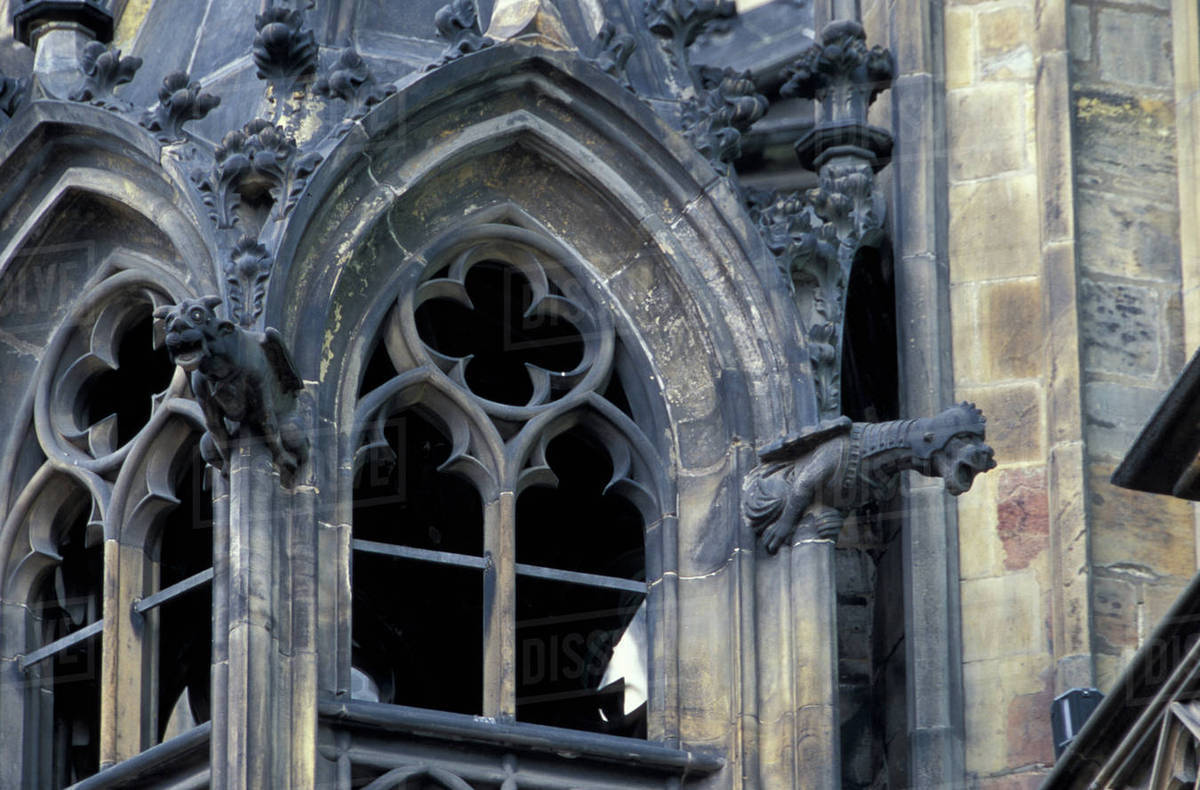 Europe, Czech Republic, Prague, Castle window detail and gargoyle ...
