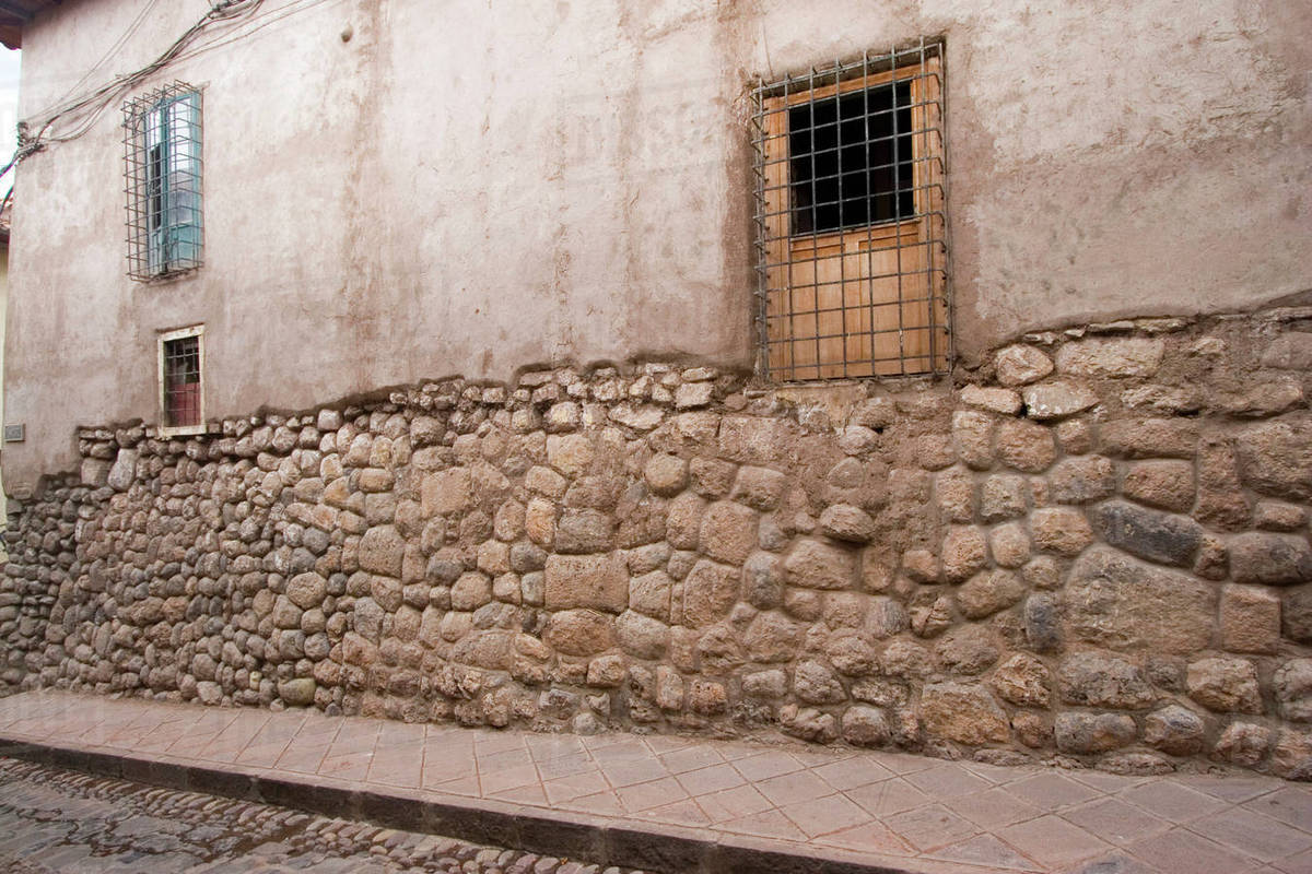 South America - Peru. Old Inca wall foundation along cobblestone street ...