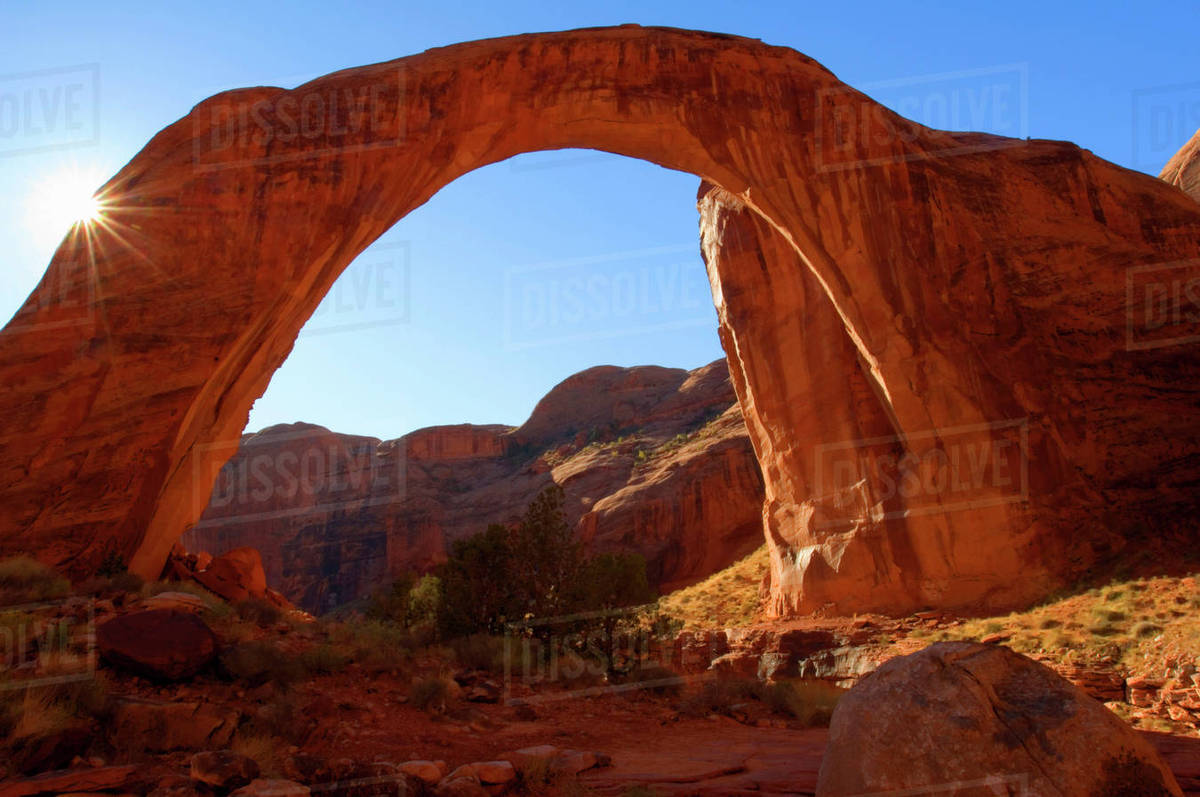Morning Sun Rising behind Rainbow Bridge, Utah - Royalty-free Stock ...