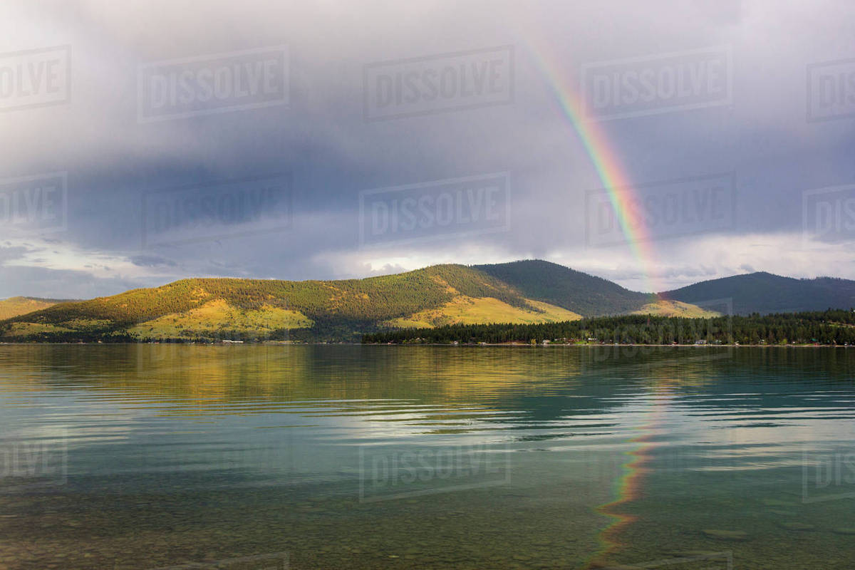 Rainbow over Flathead Lake in Elmo, Montana, USA. - Stock Photo - Dissolve