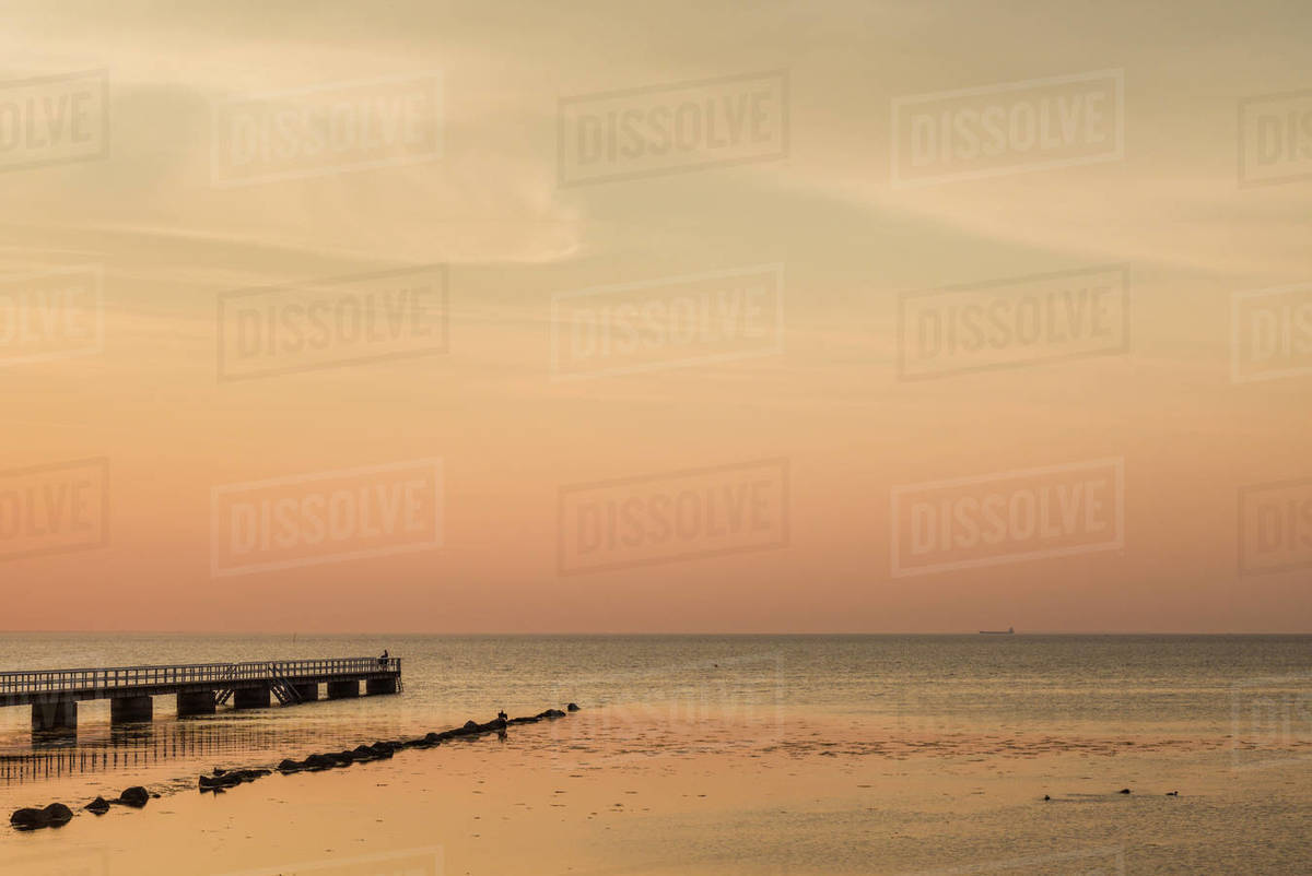 Sweden, Scania, Malmo, Riberborgs Stranden beach area, pier at sunset ...