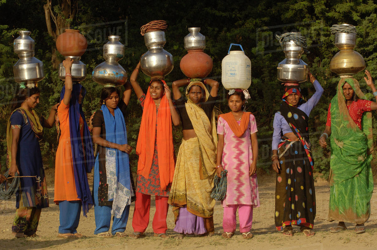 Hindu Woman collecting water from a well in a village near Bharatpur ...