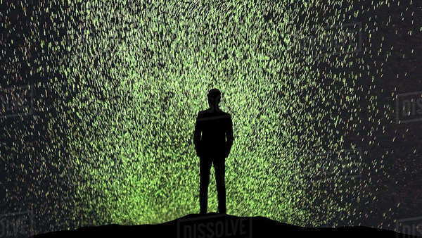 The human silhouette standing on a small shiny particles background ...