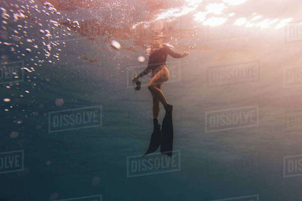 Woman treading water near surface of sea - Royalty-free Stock Photo ...
