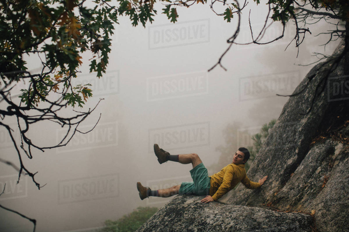 Young man falling on rock, near Shaver Lake, California, USA - Royalty ...