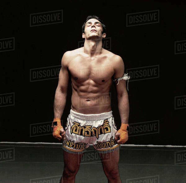 Boxer breathing on mat - Stock Photo - Dissolve