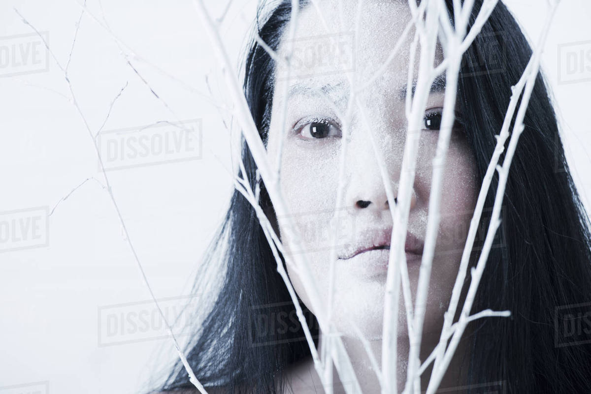 Woman's face covered in powder - Stock Photo - Dissolve