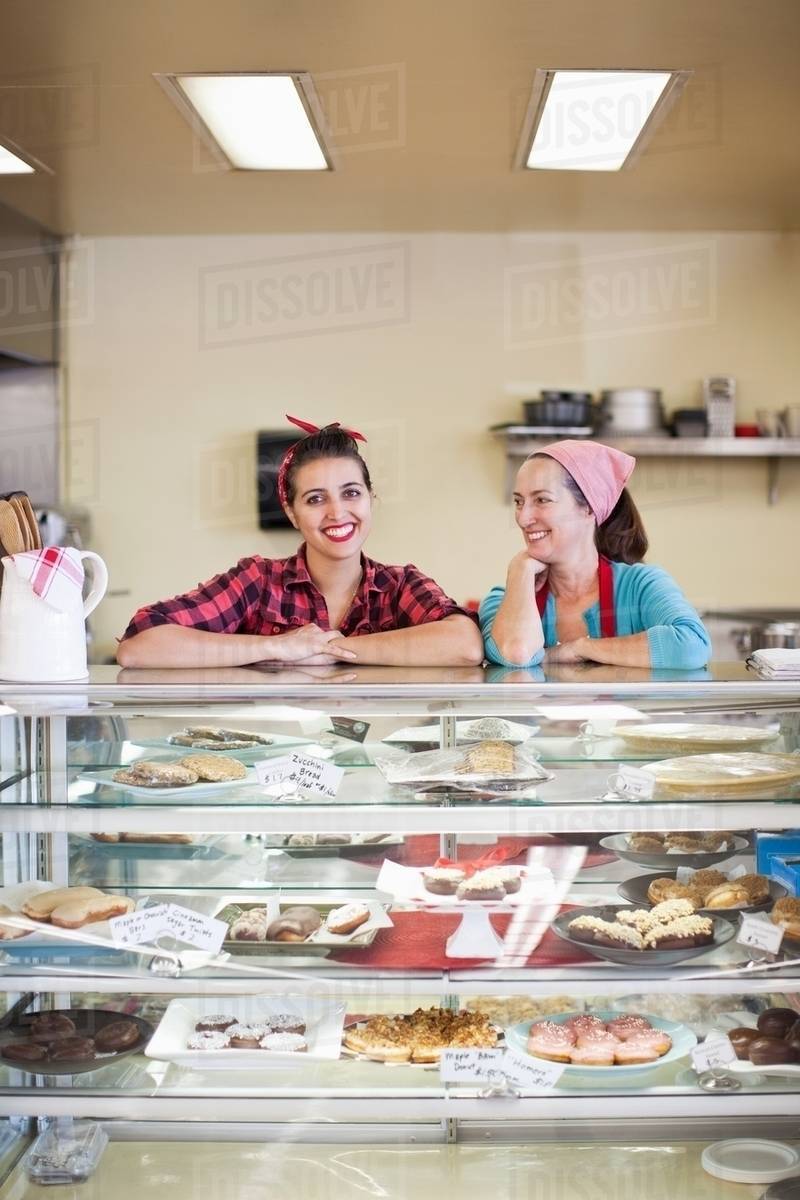 Two women standing at counter of bakery - Royalty-free Stock Photo ...