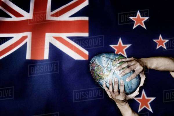 New Zealand flag and world rugby ball - Stock Photo - Dissolve