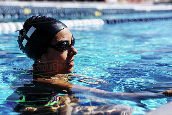 Swimmer in water in pool - Stock Photo - Dissolve