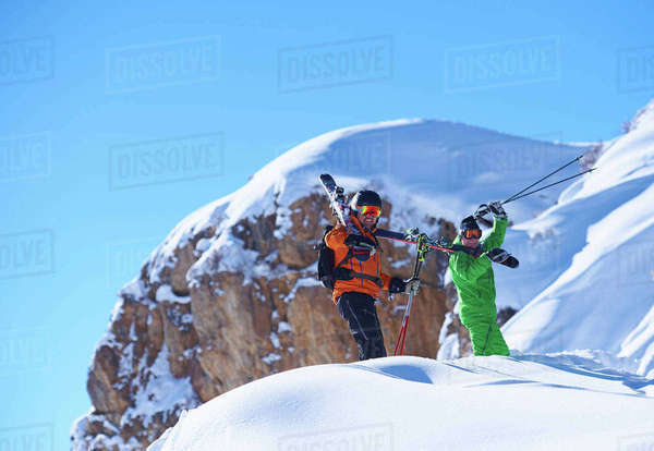Two male skiers trudging up snow covered ridge, Aspen, Colorado, USA ...