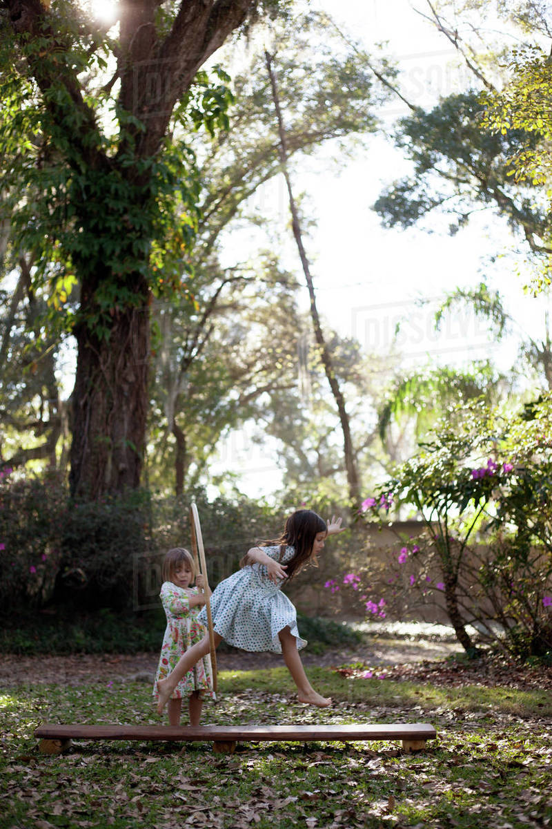 Girl in dress running through plastic hoop - Royalty-free Stock Photo ...