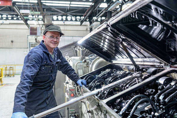 Portrait of locomotive engineer in train works - Stock Photo - Dissolve