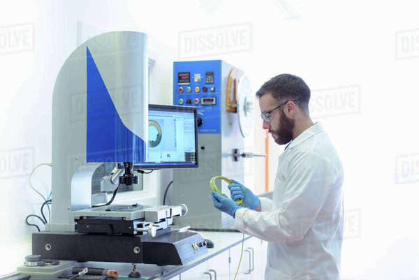 Scientist testing electrical cable in electrical cable laboratory ...