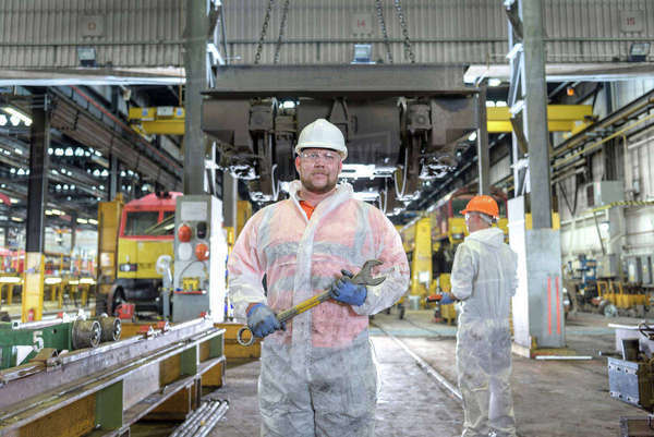 Portrait of locomotive engineer in train works - Stock Photo - Dissolve