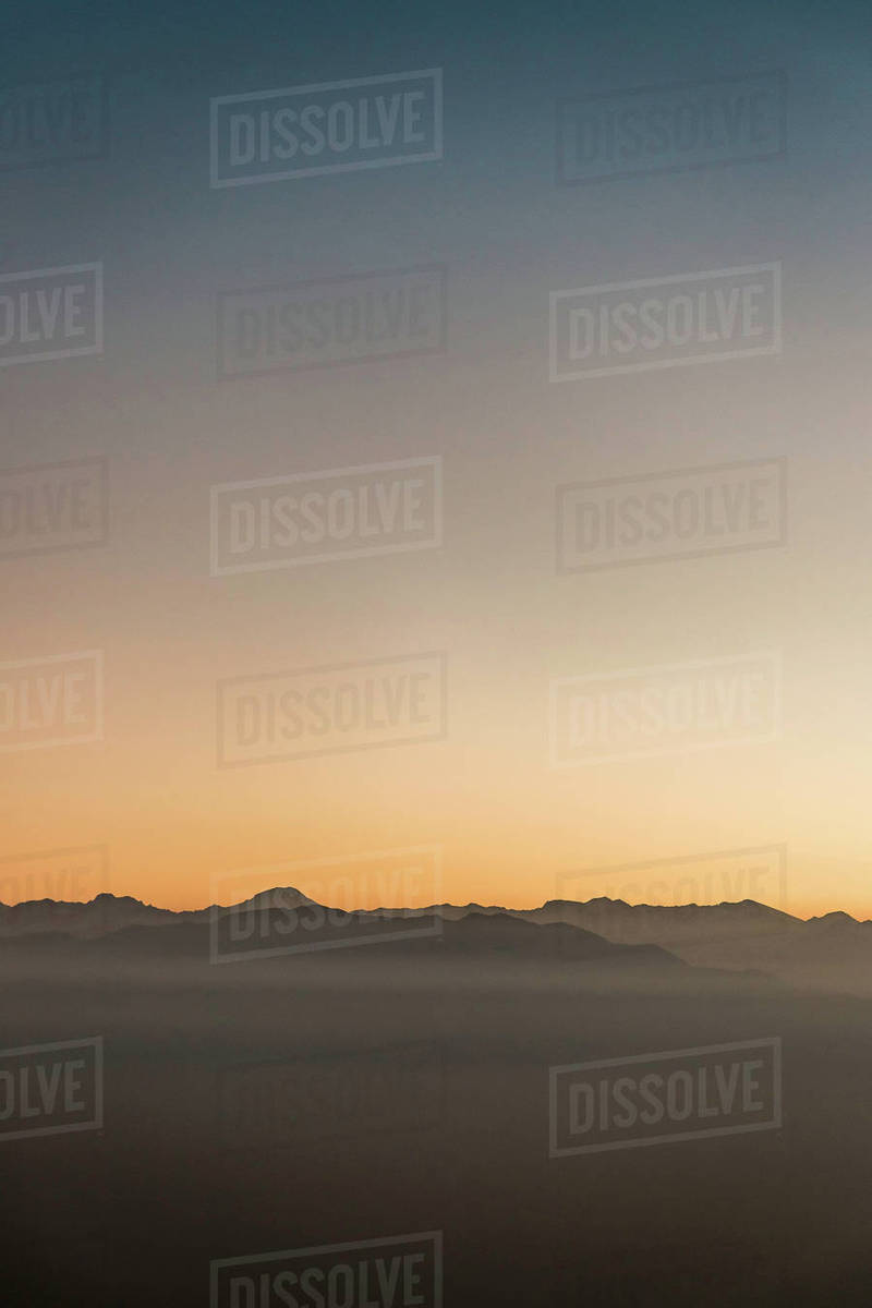 Aerial view of sunset over mountains, Metropolitan Region, Chile ...