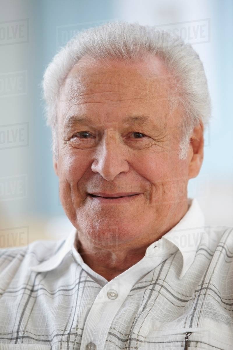 Senior man looking at camera, portrait - Stock Photo - Dissolve