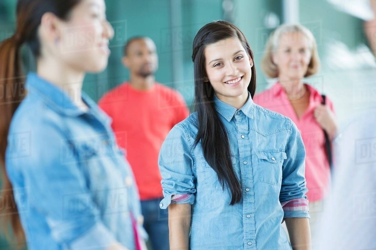 Young woman in crowd - Royalty-free Stock Photo | Dissolve