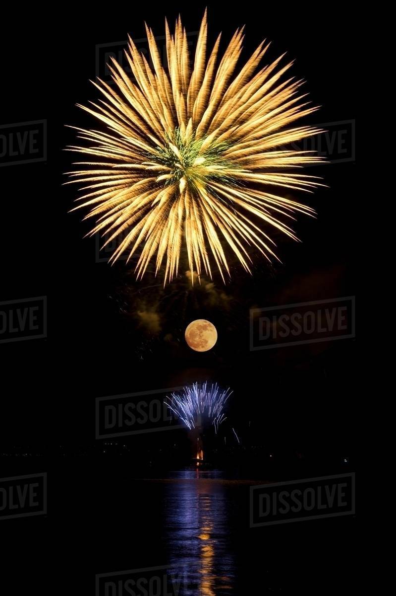 Firework in the sky above the moon - Stock Photo - Dissolve