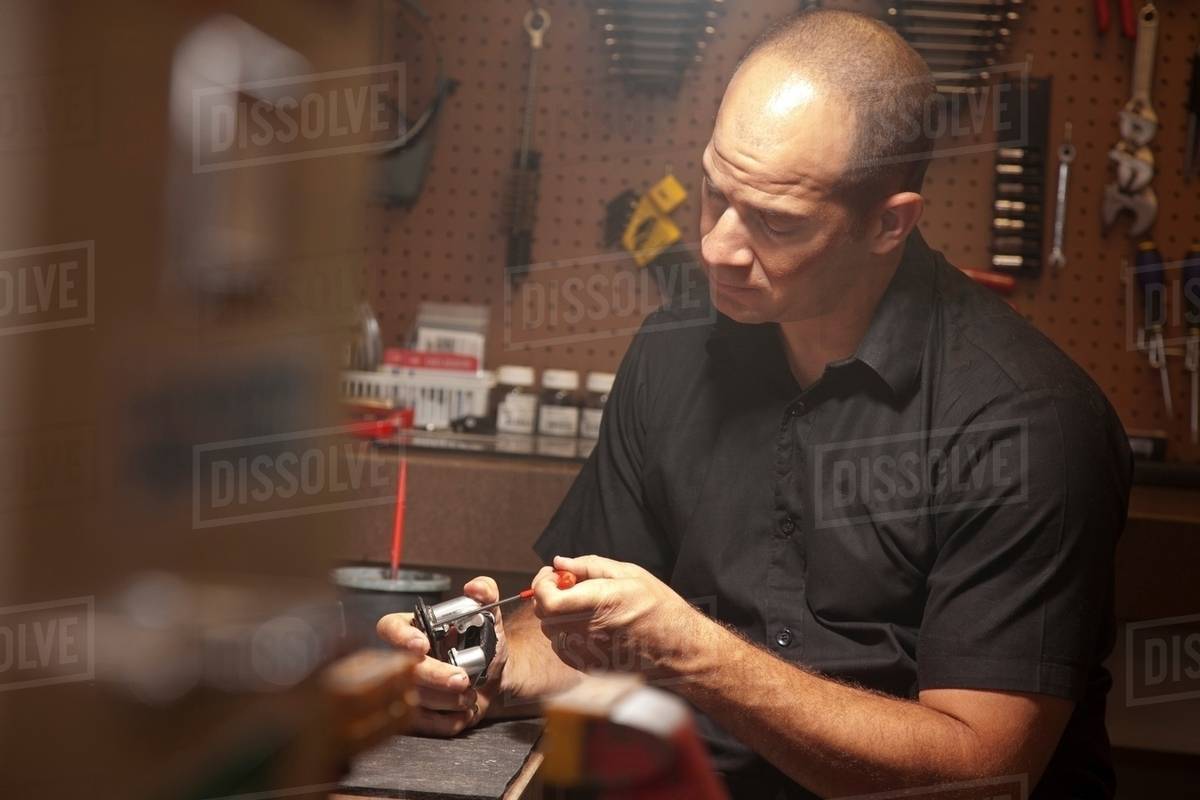 Man working in workshop - Royalty-free Stock Photo | Dissolve