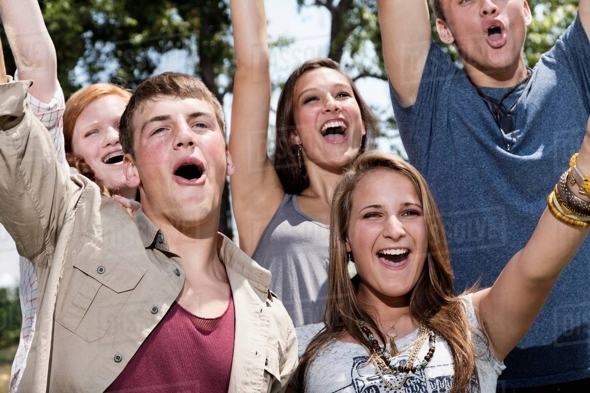 Five friends cheering, close up - Stock Photo - Dissolve