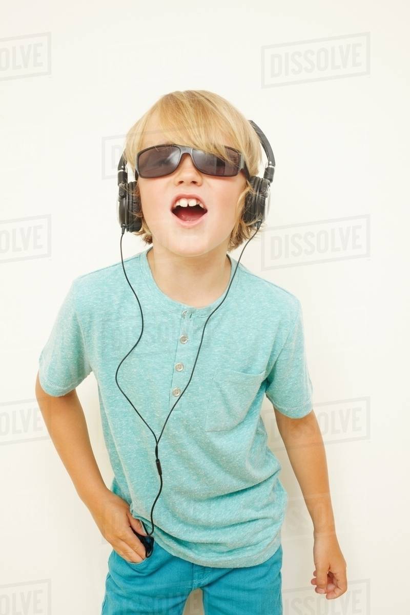 Boy wearing headphones and sunglasses - Royalty-free Stock Photo | Dissolve