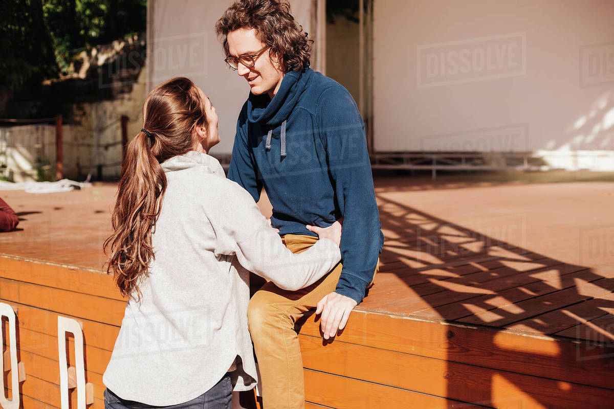 Couple talking on stage - Stock Photo - Dissolve