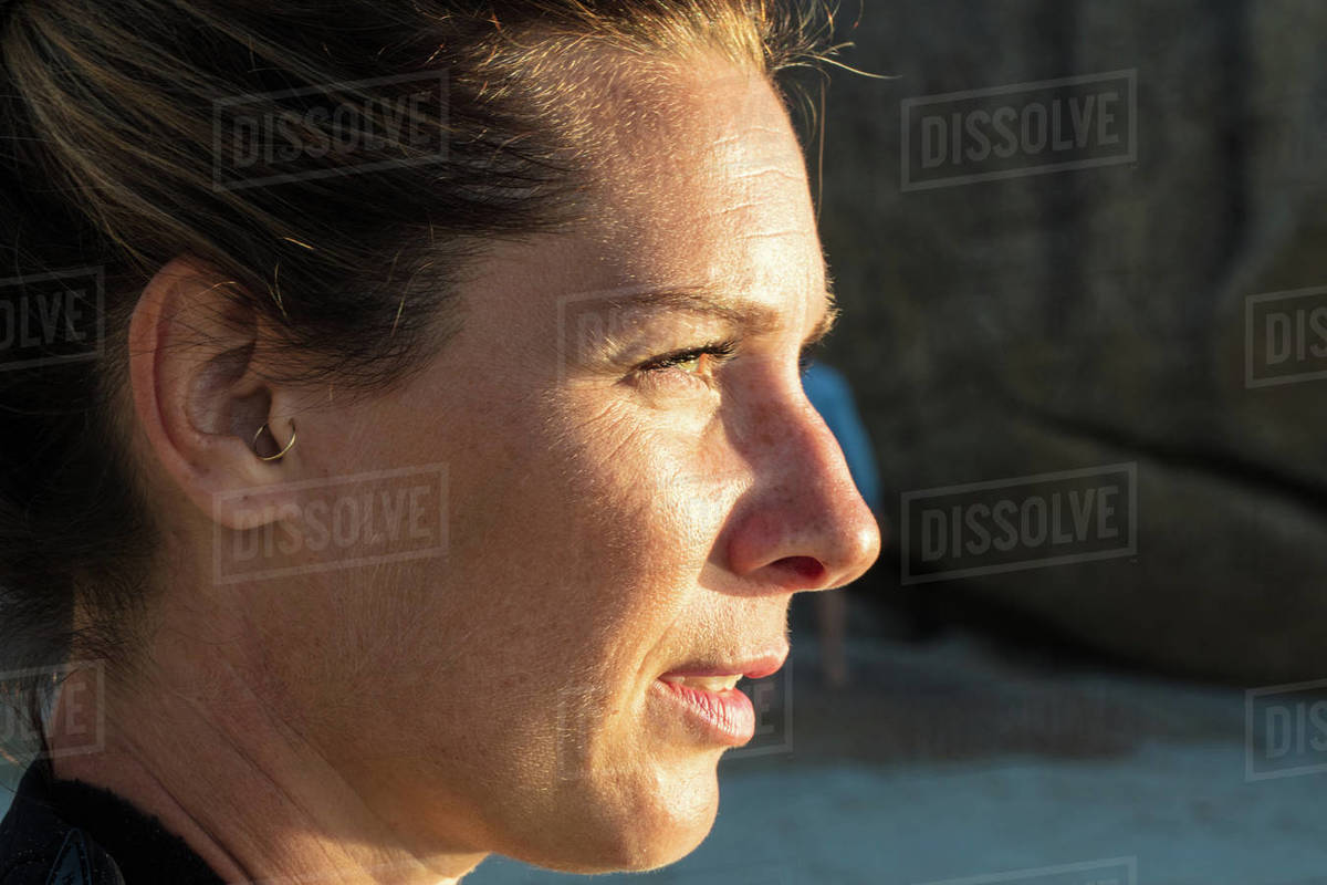 Female surfer at beach, sideview headshot, Cape Town, Western Cape ...