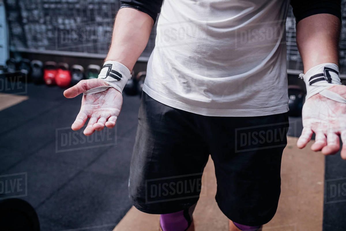 Young man showing powdered palms in gym - Royalty-free Stock Photo ...