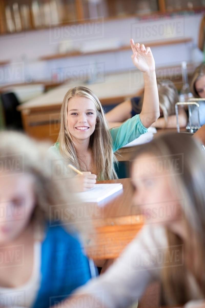 Student putting her hands up - Royalty-free Stock Photo | Dissolve