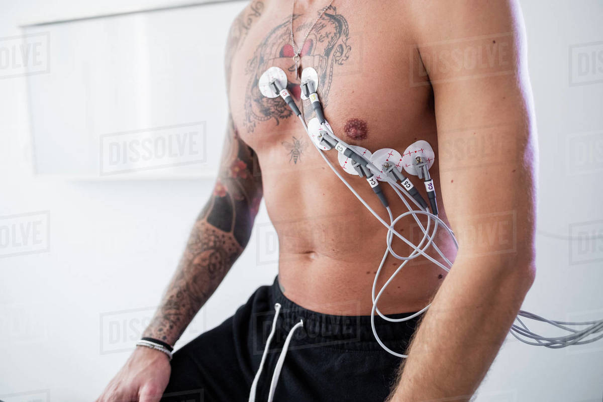 Patient undergoing ECG test in consultation room - Royalty-free Stock ...