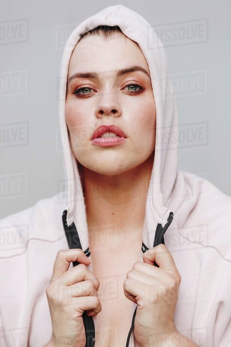 Portrait of woman in hoodie - Royalty-free Stock Photo | Dissolve