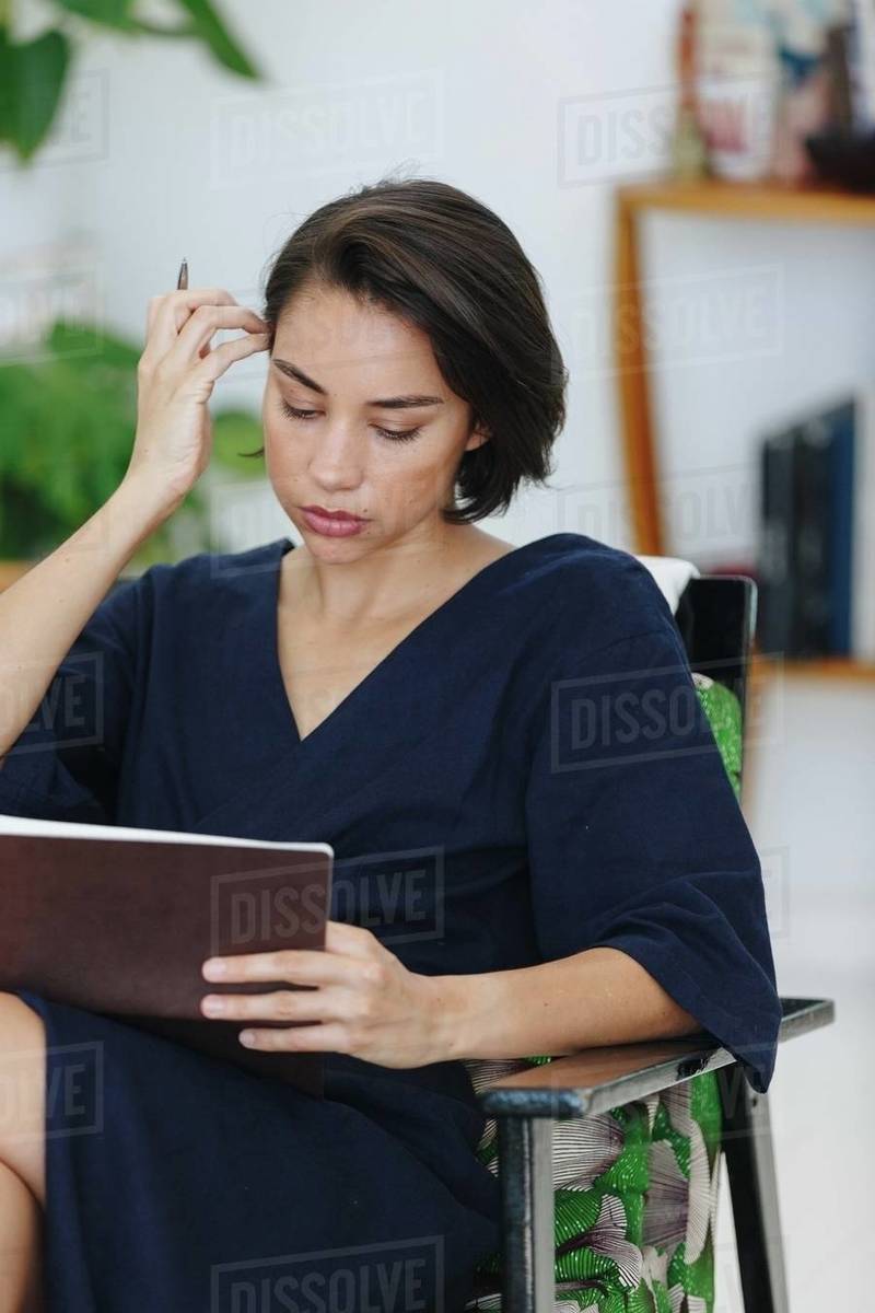 Businesswoman preparing paperwork in office - Royalty-free Stock Photo ...
