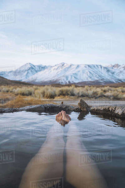 Woman enjoying hot spring in cold winter, Mammoth Lakes Hot Spring ...