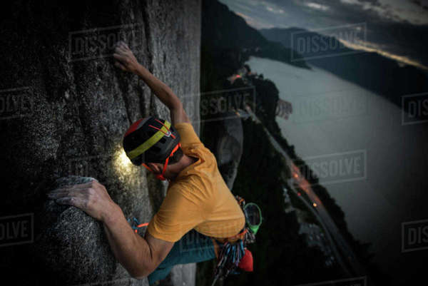 One person trad climbing at night with helmet and headlight, Squamish ...