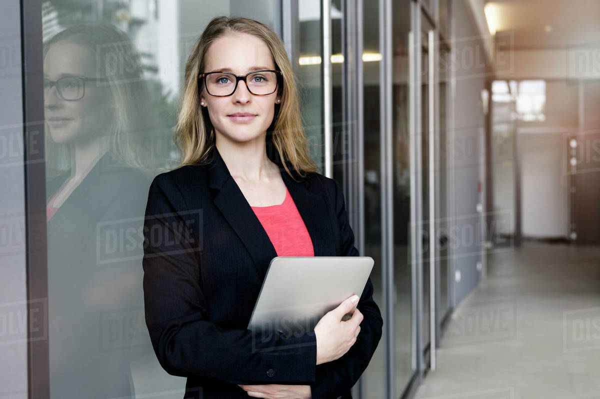 Portrait of young blond businesswoman wearing glasses. - Stock Photo ...