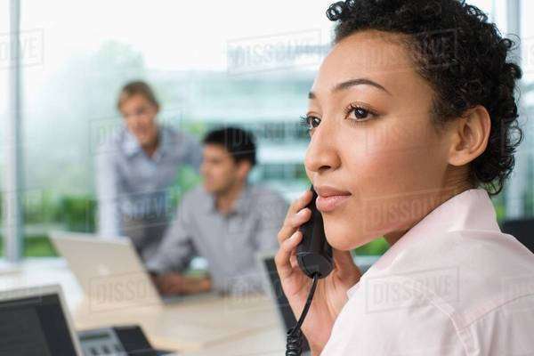 Office worker on telephone - Royalty-free Stock Photo | Dissolve