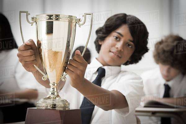 Boy with trophy - Stock Photo - Dissolve