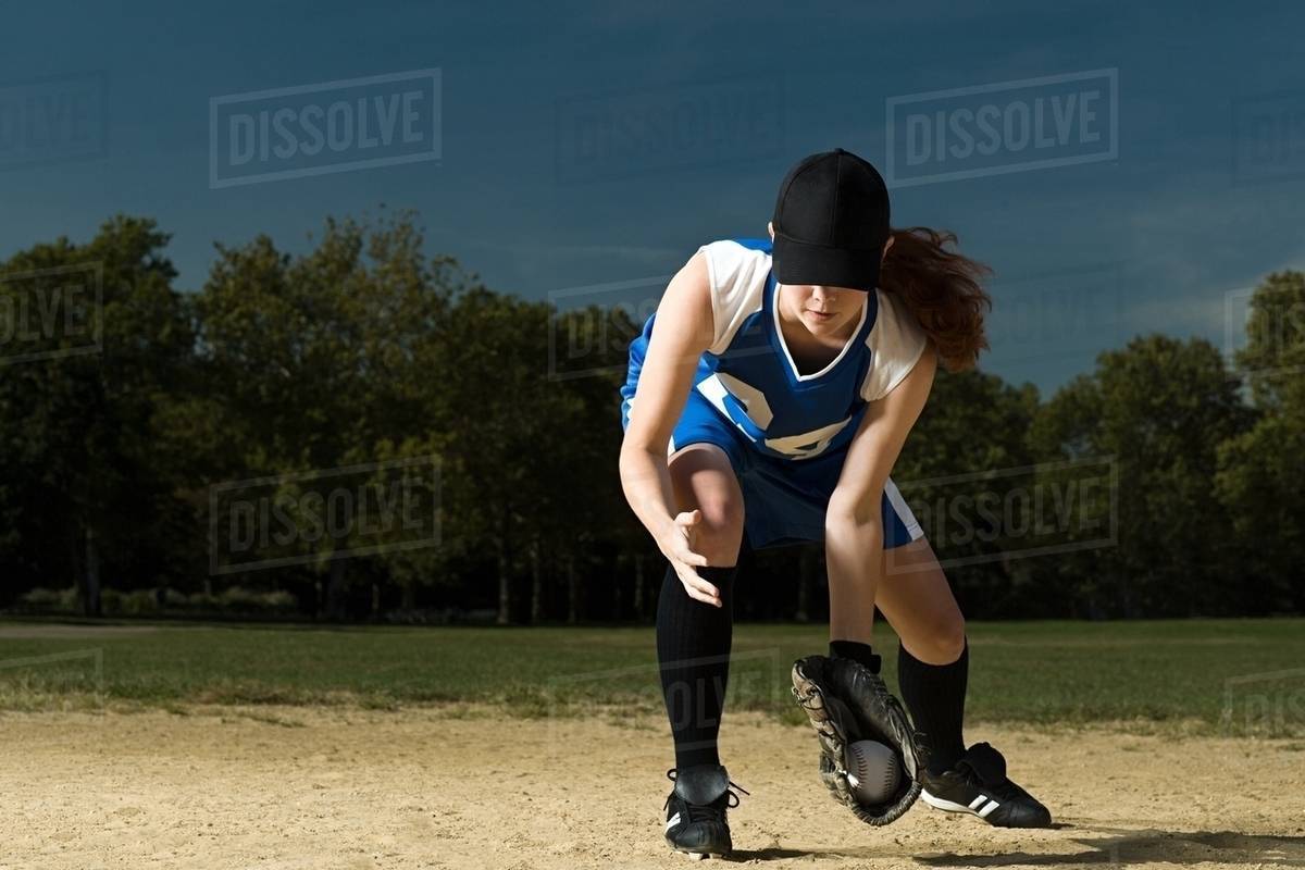 Woman playing baseball - Royalty-free Stock Photo | Dissolve