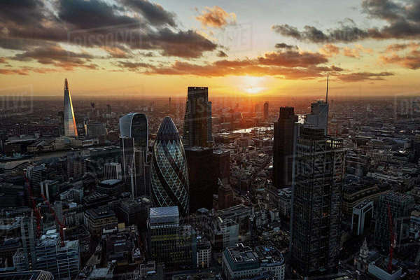 UK, London, High angle view of City of London skyscrapers at sunset ...