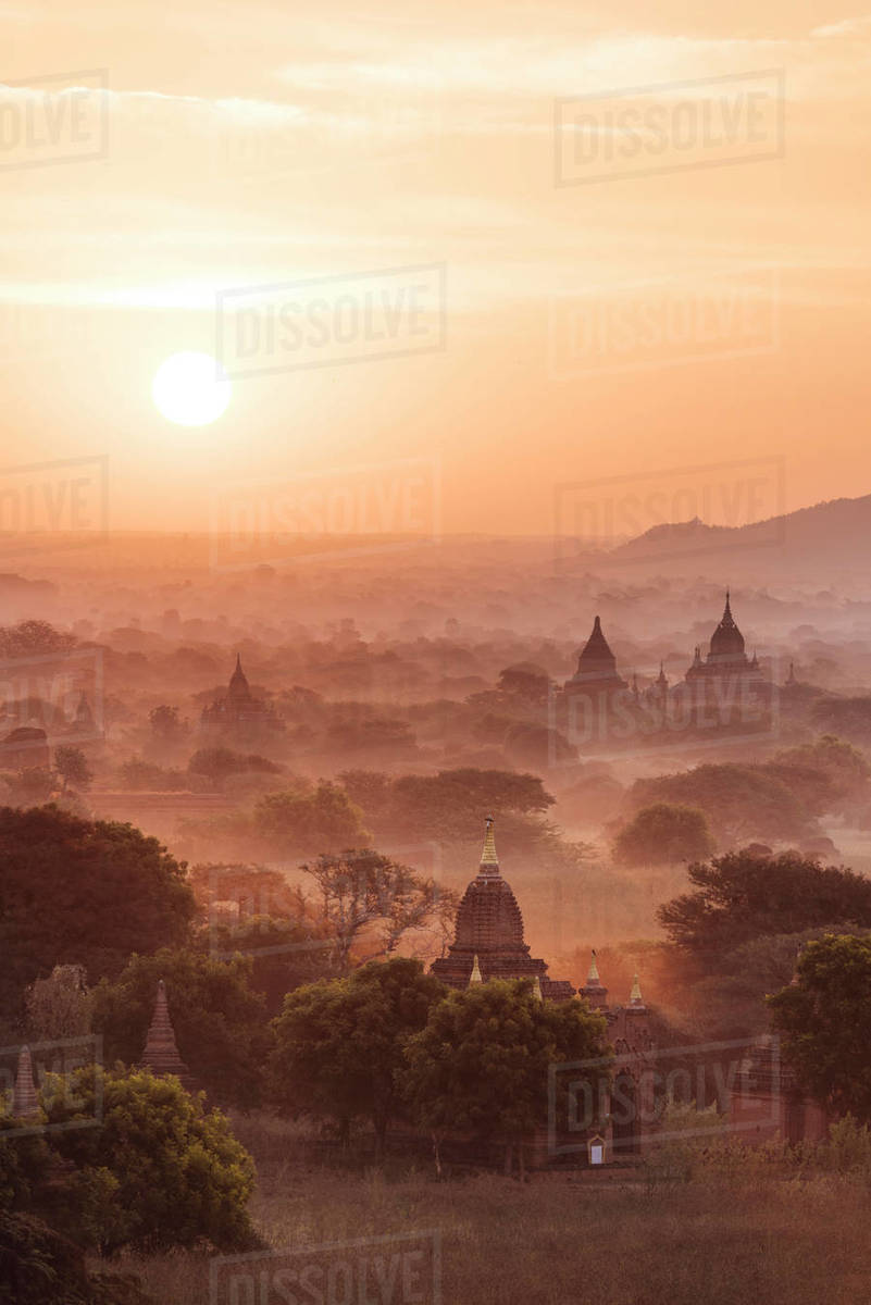 Myanmar, Bagan, view of temples in morning mist - Royalty-free Stock Photo | Dissolve