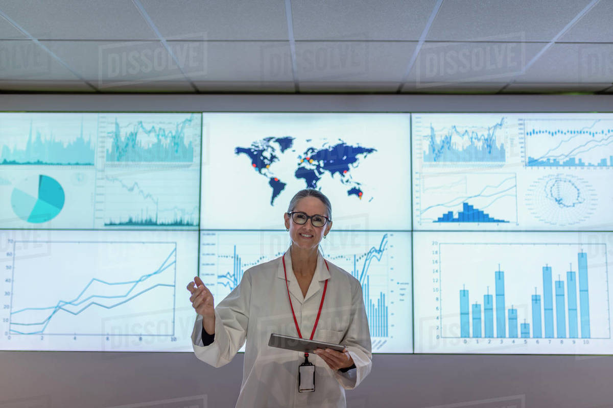 Portrait of smiling researcher at interactive screens - Stock Photo ...