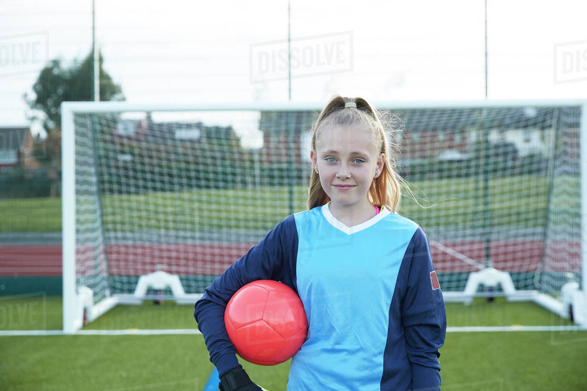 Portrait of a young girl soccer player - Stock Photo - Dissolve